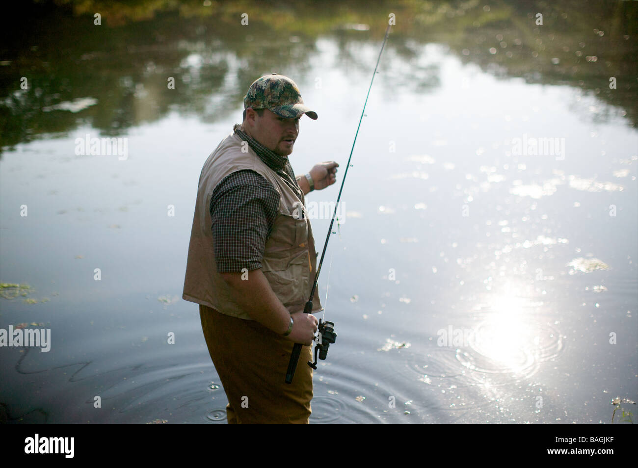 Big man getting ready to cast a line gives us a sidelong glance before ...