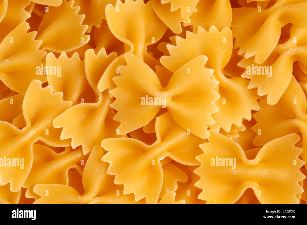 Italian pasta - farfalle or bow tie pasta as food background Stock ...