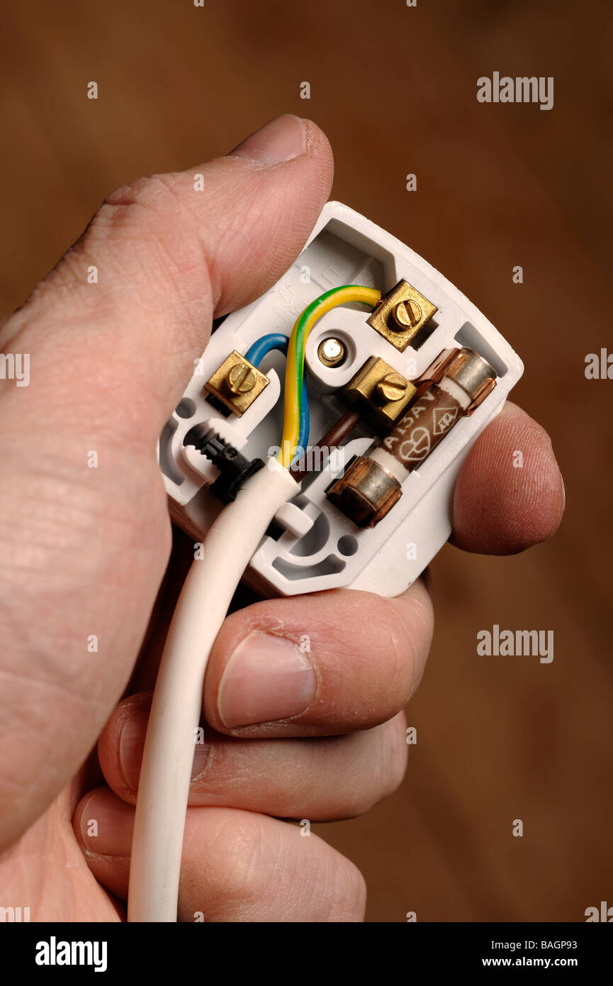 Man changing a plug Stock Photo - Alamy