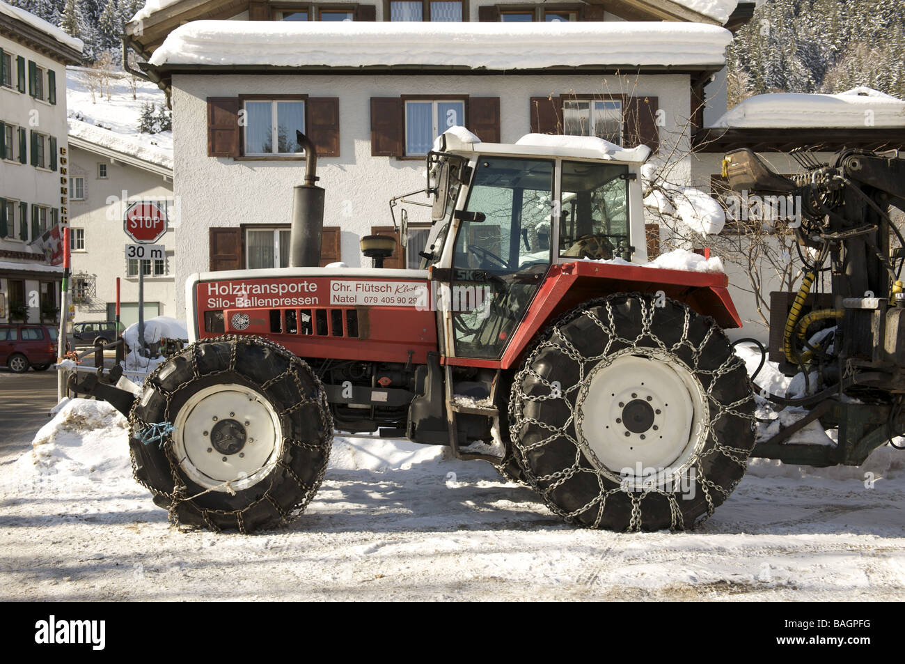 Tractor with snow chains Stock Photo - Alamy