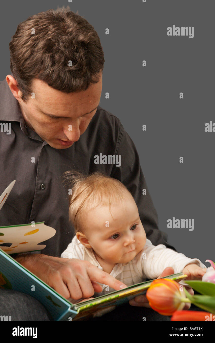 Father reads to baby hi-res stock photography and images - Alamy