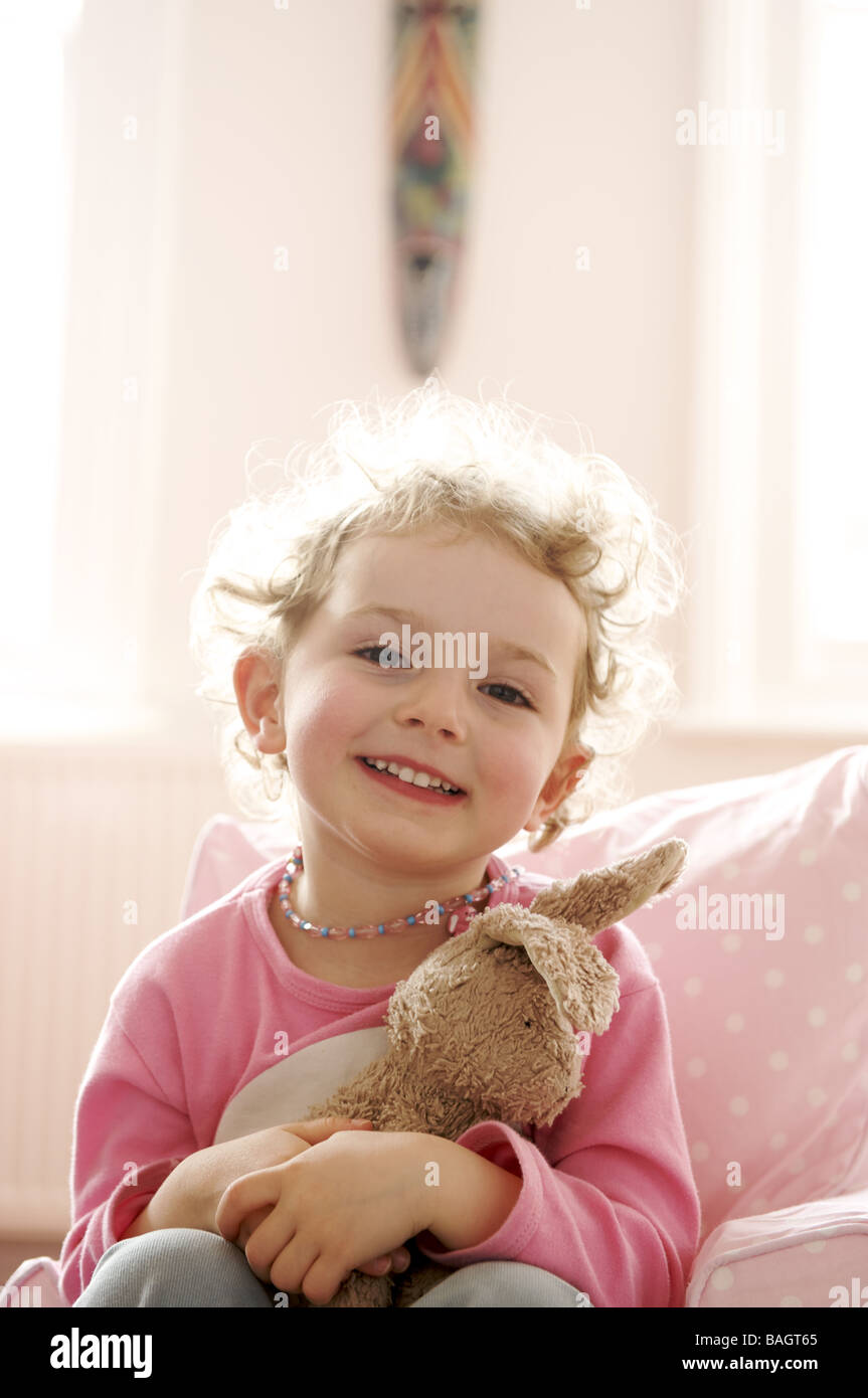 Young girl with bunny cuddly toy Stock Photo - Alamy