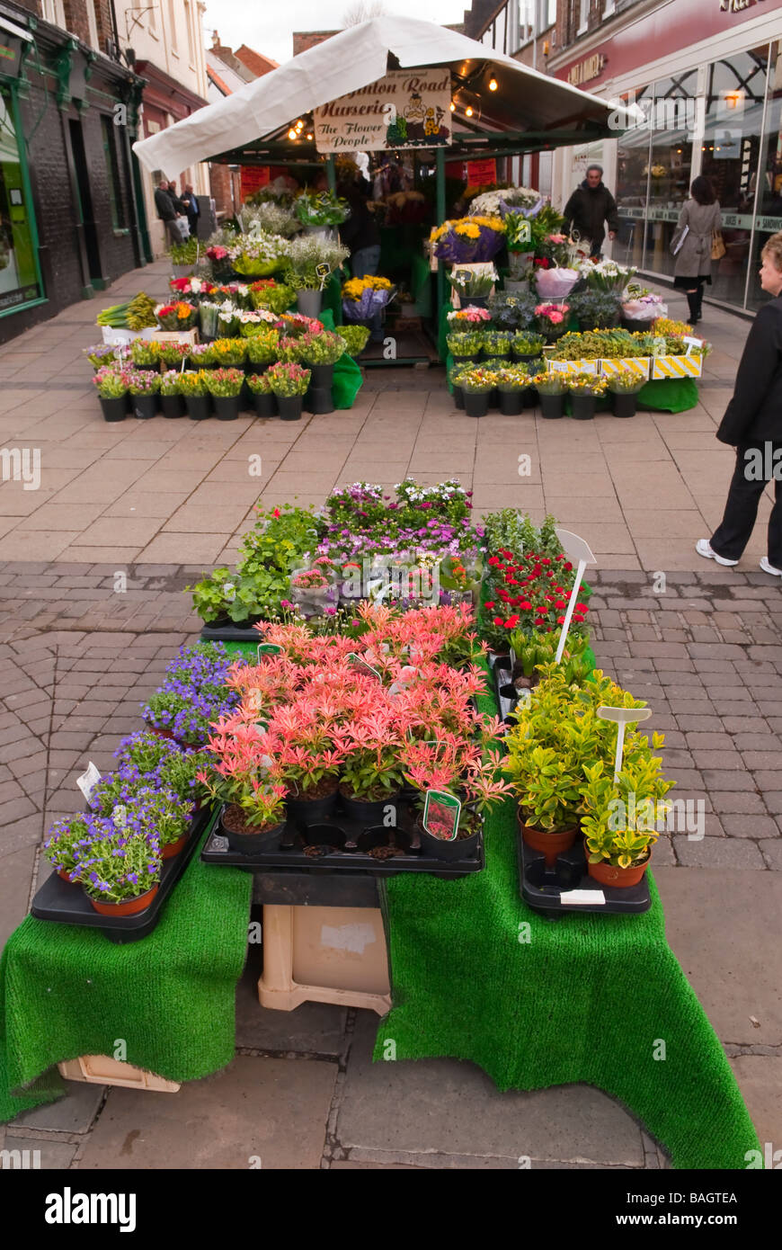 An outdoor market stall florists shop store selling fresh flowers in ...