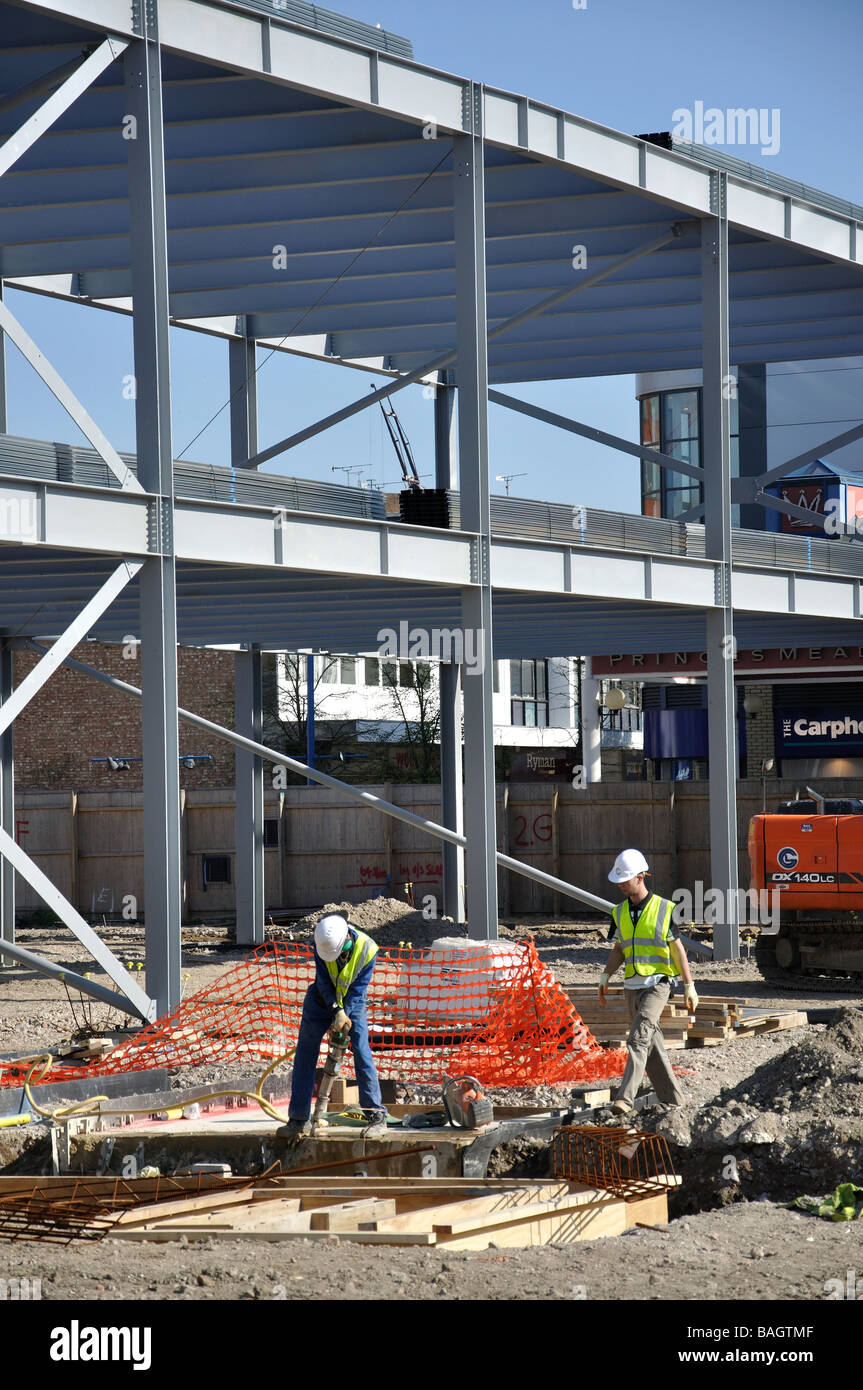 Workers on building construction site, Farnborough, Hampshire, England ...