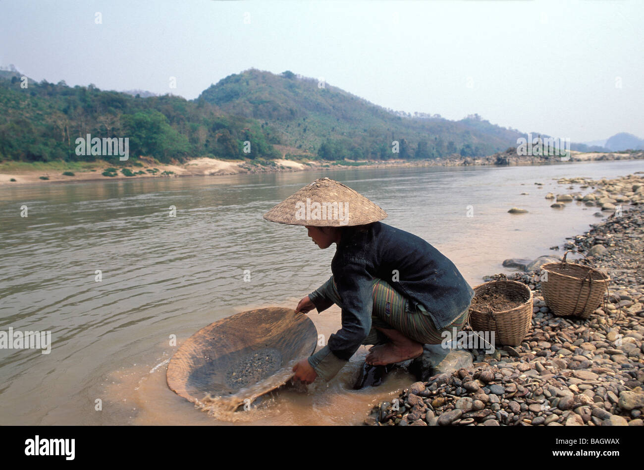 Laos, Mekong river, young woman panning for gold Stock Photo - Alamy