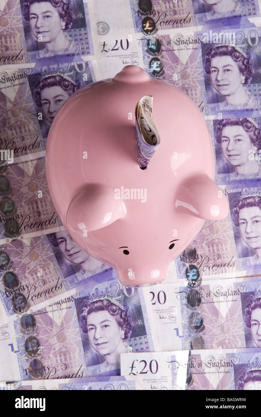 Piggy bank with British Money Stock Photo - Alamy