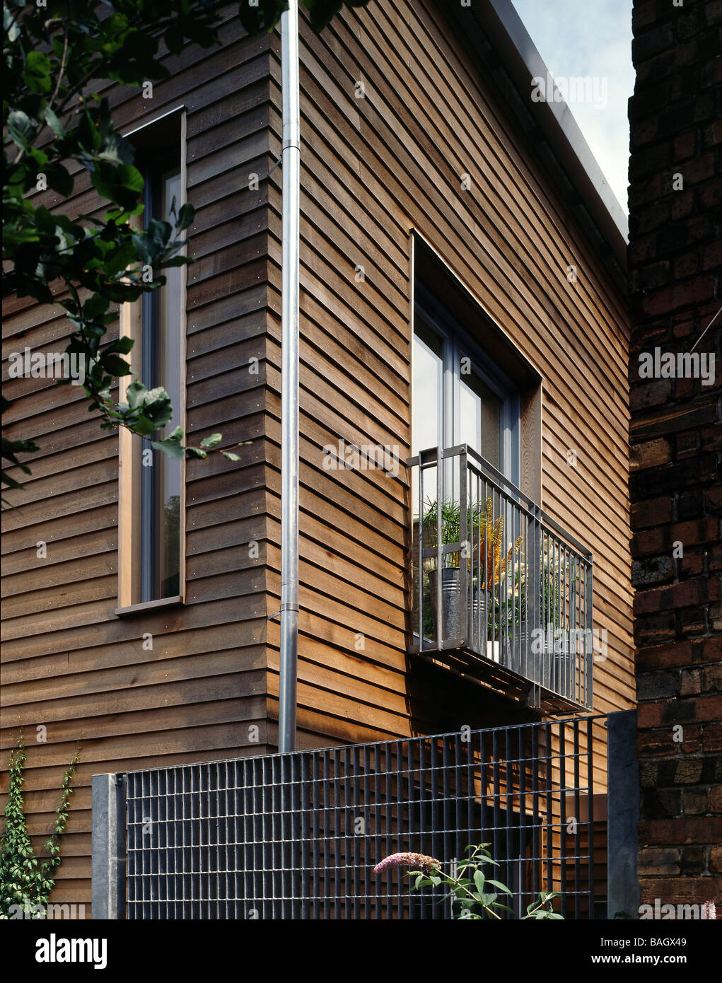 private house slit window and balcony detail Stock Photo - Alamy