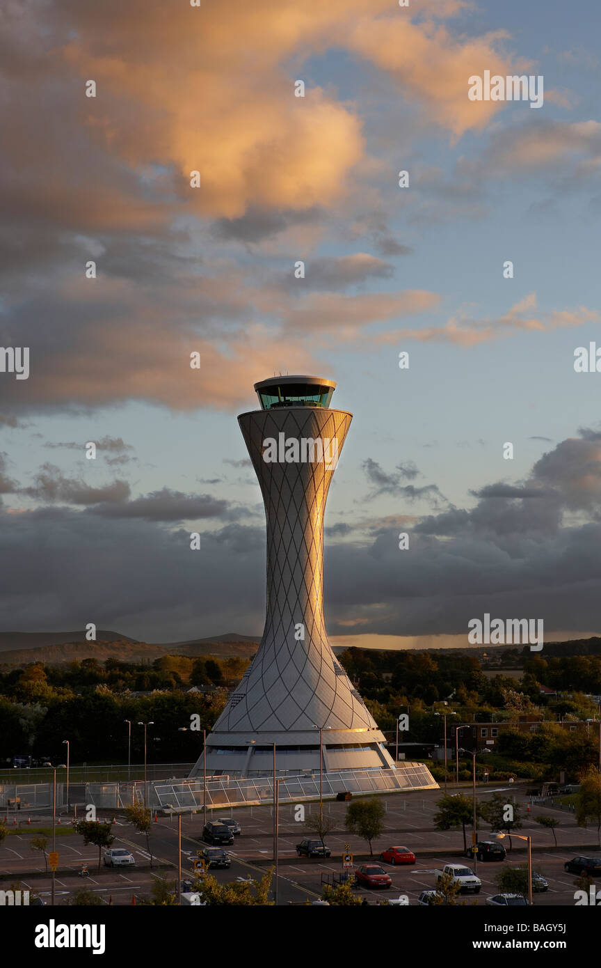air traffic control tower portrait view from car park with pink clouds ...