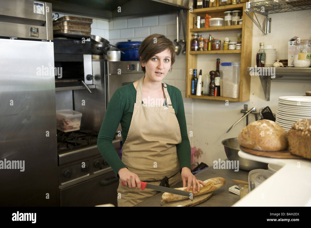 Woman making a sandwich at a sandwich shop Stock Photo - Alamy