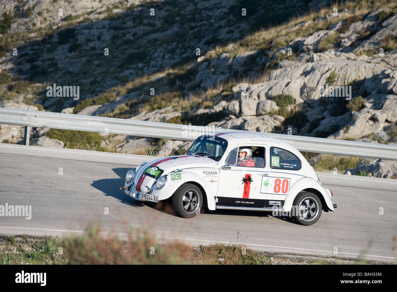 White 1965 Volkswagen Beetle classic car racing in the Classic car ...
