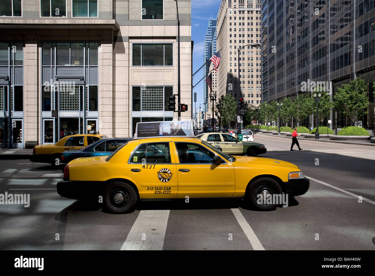 United States, Illinois, Chicago, Loop District, yellow taxi in front ...