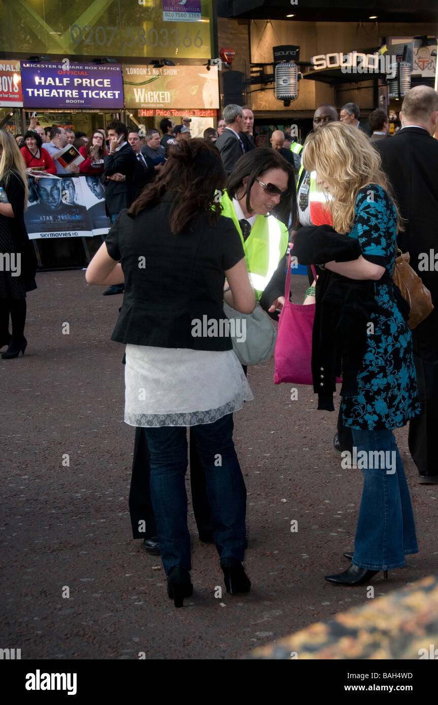 Security guard checking bags at the premiere of the new Star Trek movie ...