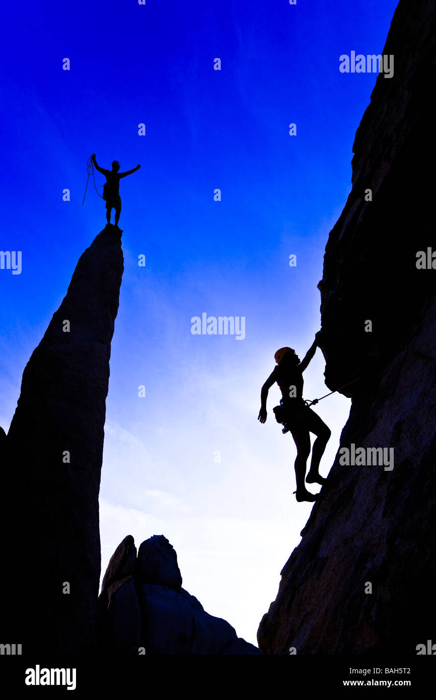 Team of rock climbers nearing the summit Stock Photo - Alamy
