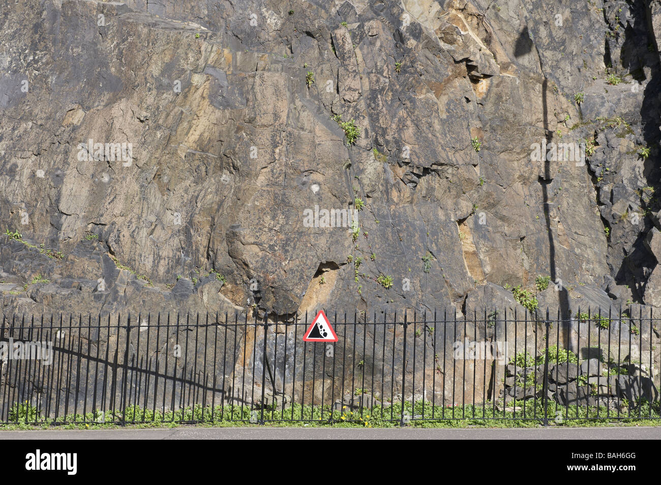 Rock face with danger sign Stock Photo - Alamy