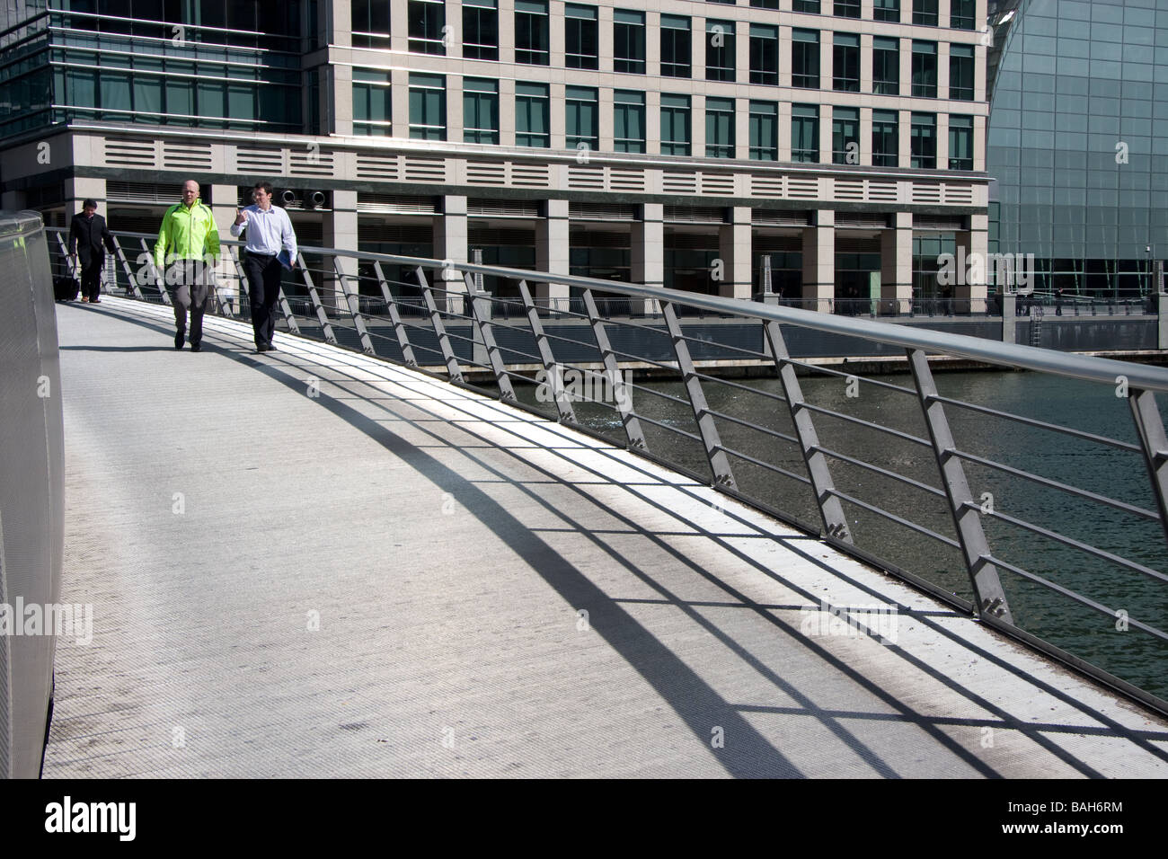modern wide footbridge commuters dock office light Heron Quay Docklands ...