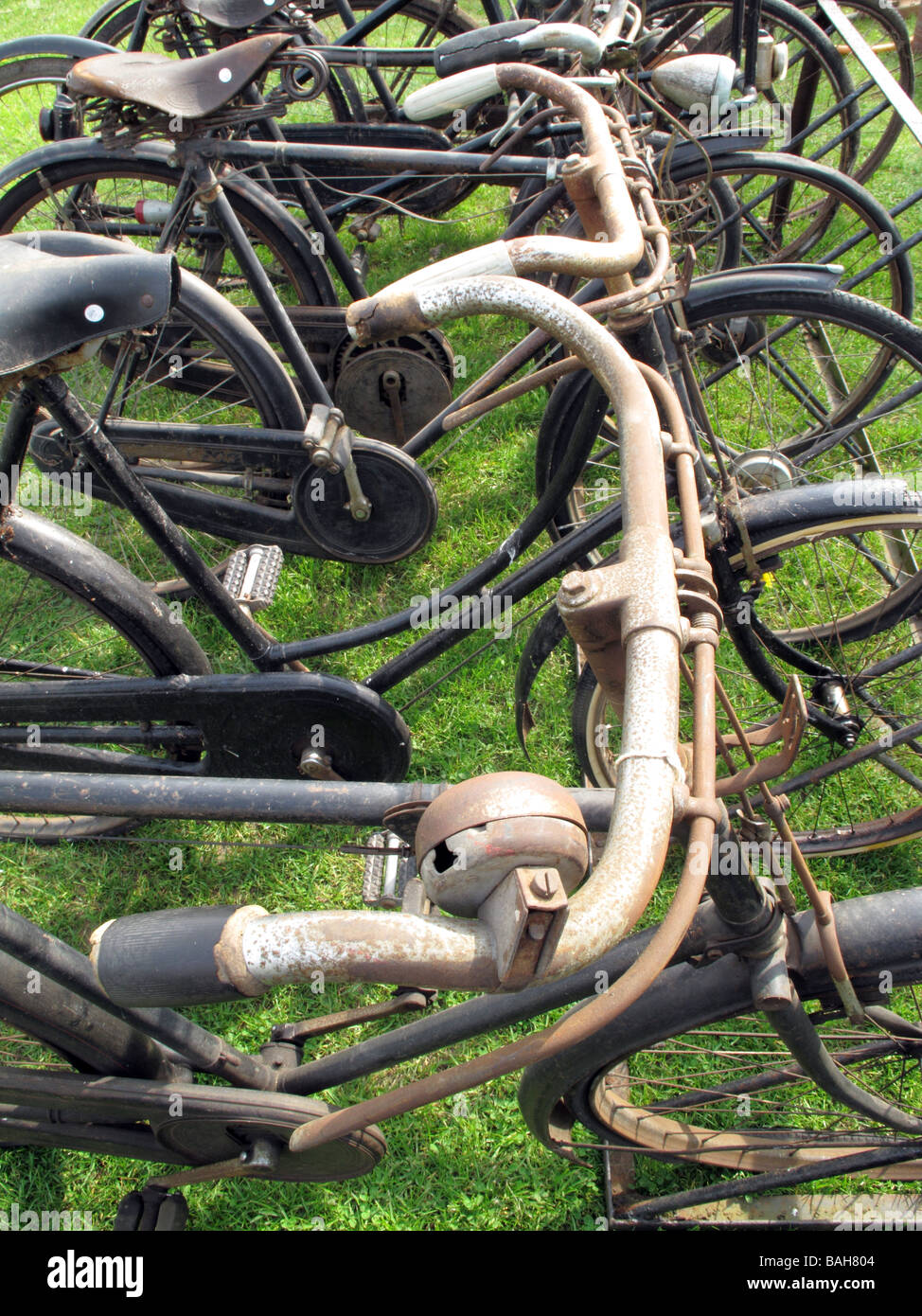 Row of rusty bicycles in rack waiting to be sold at auction Stock Photo ...