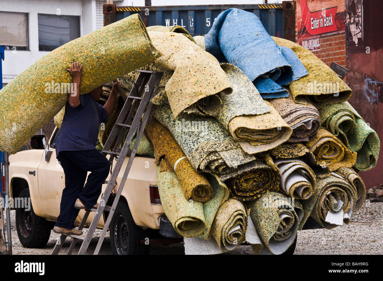 Carpet padding being loaded on a truck on the way to be recycled Los ...