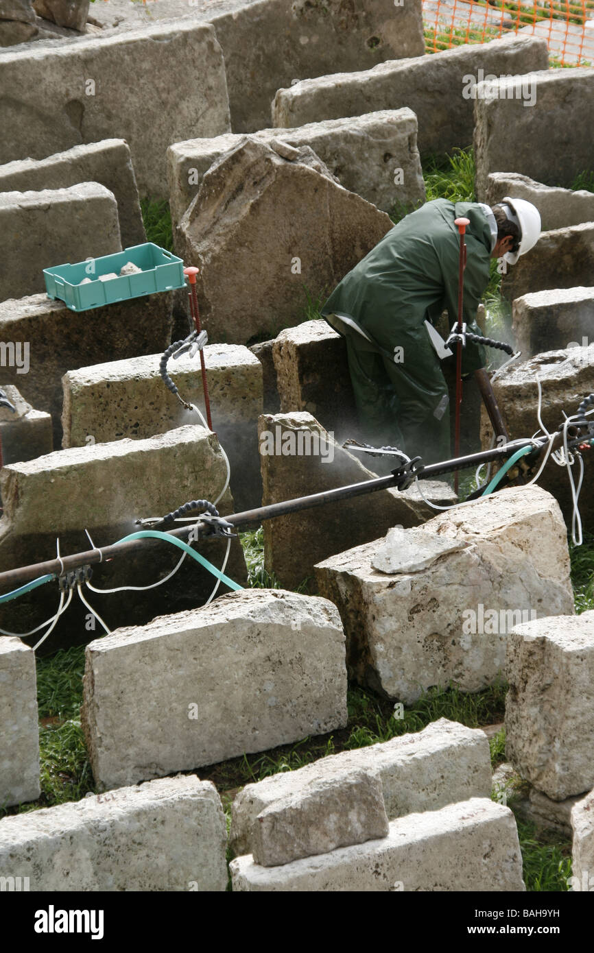 archaeologist cleaning ancient roman relics in the largo argentina ...