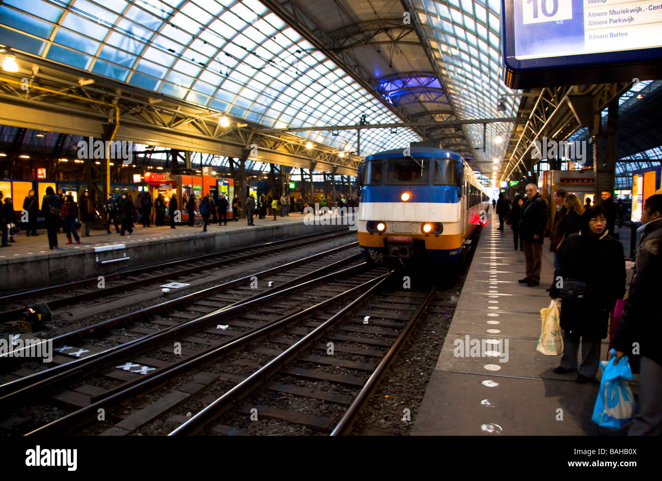 Trains coming in Central Railway Station of Amsterdam, Netherlands ...
