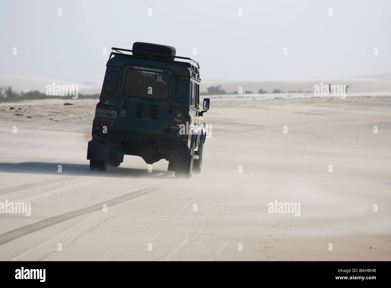 Land Rover on windblown beach Stock Photo - Alamy