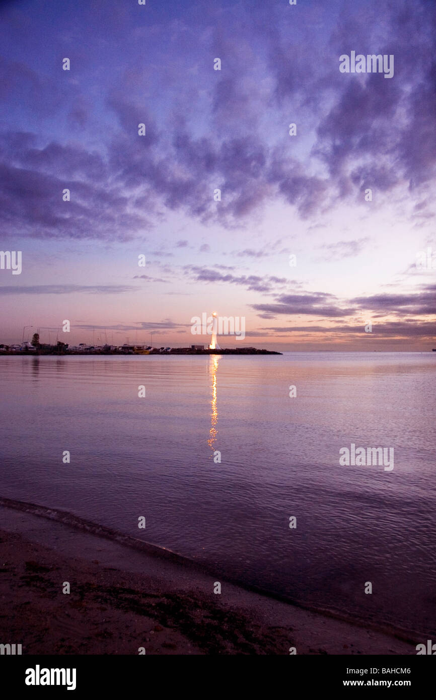 Lighthouse with purple sunset Stock Photo - Alamy