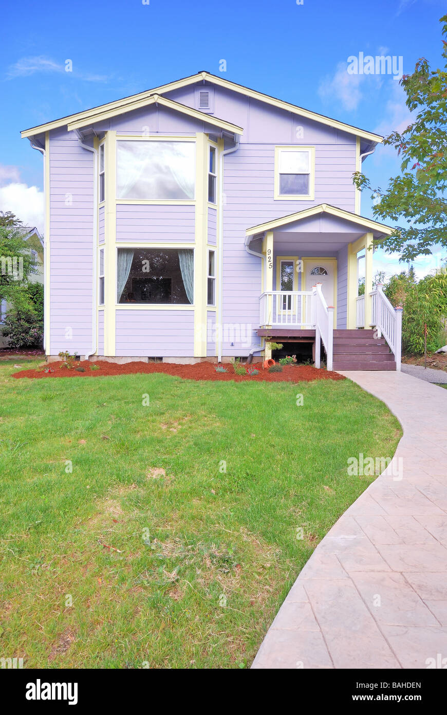 Full front elevation of two-story lavender house, showing front lawn ...