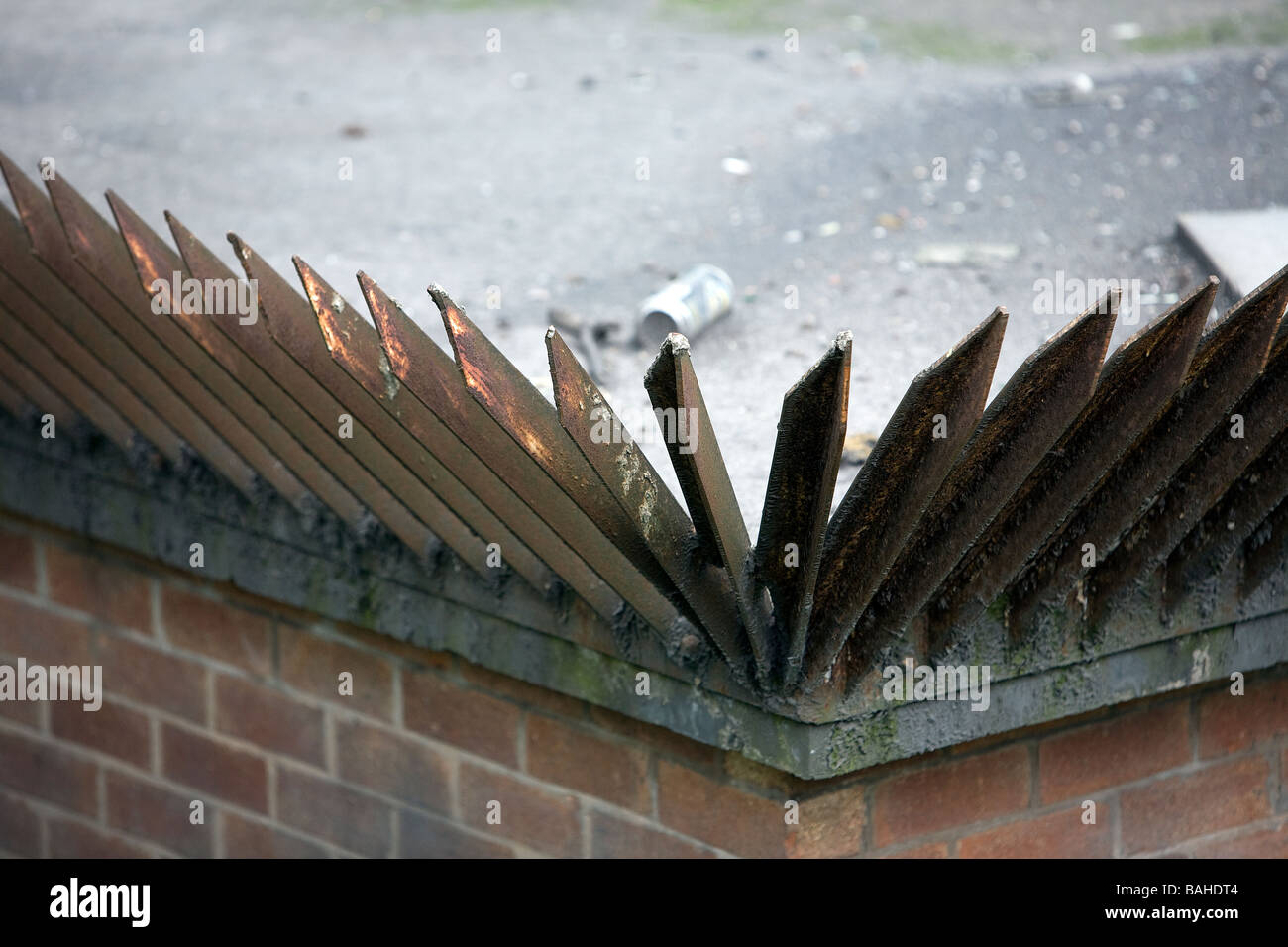 A home made security system on top of a roof consisting of pointed and ...