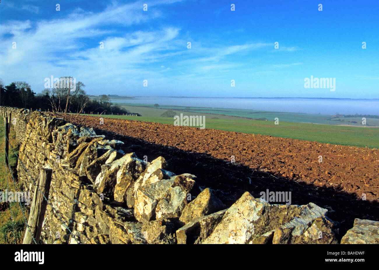 Winter sunshine and mist over the Evenlode Valley England Stock Photo ...