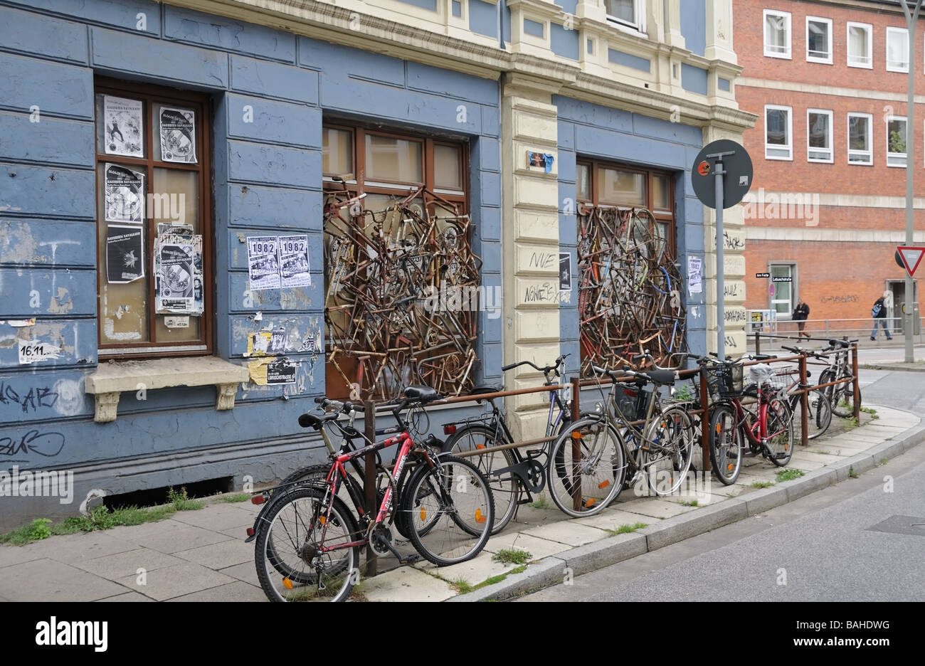 windows barricaded by carcasses of rusty bike frames Stock Photo - Alamy