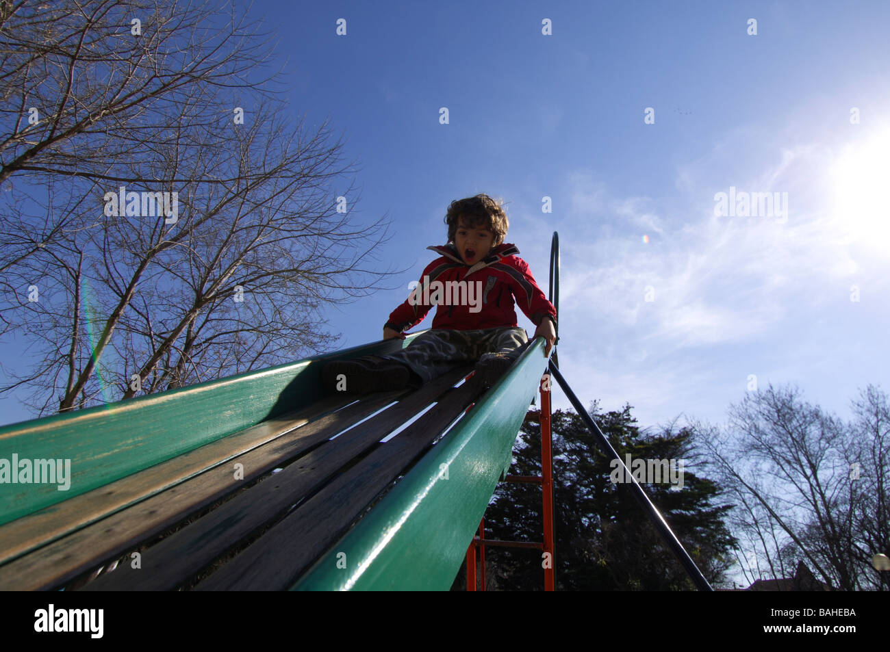 kid on a slide Stock Photo - Alamy