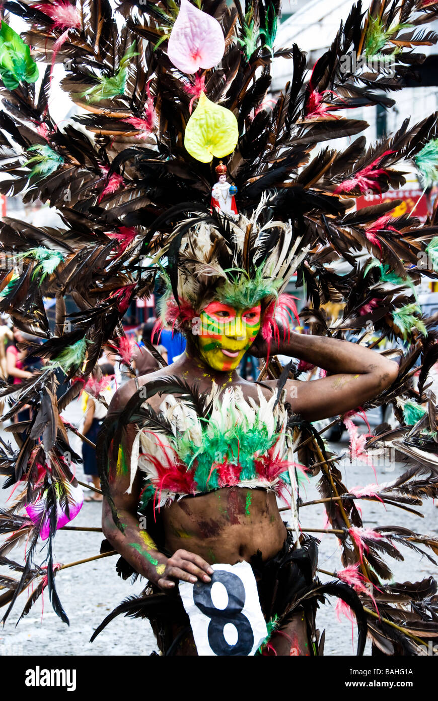 Participant in flamboyant costume at the Ati-Atihan festival in Kalibo ...
