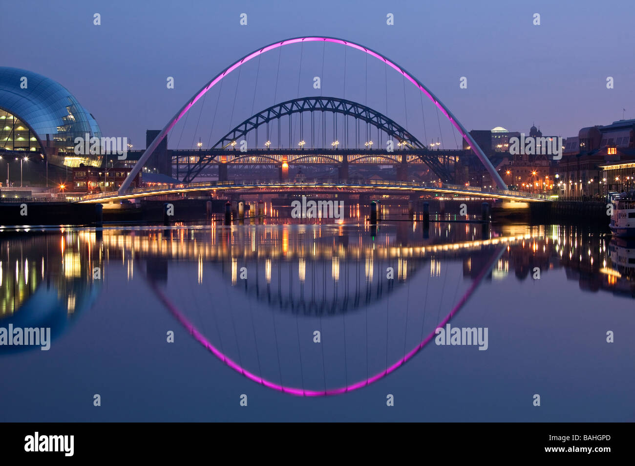A night view of the Tyne Bridge, framed by the Millennium Bridge, both ...