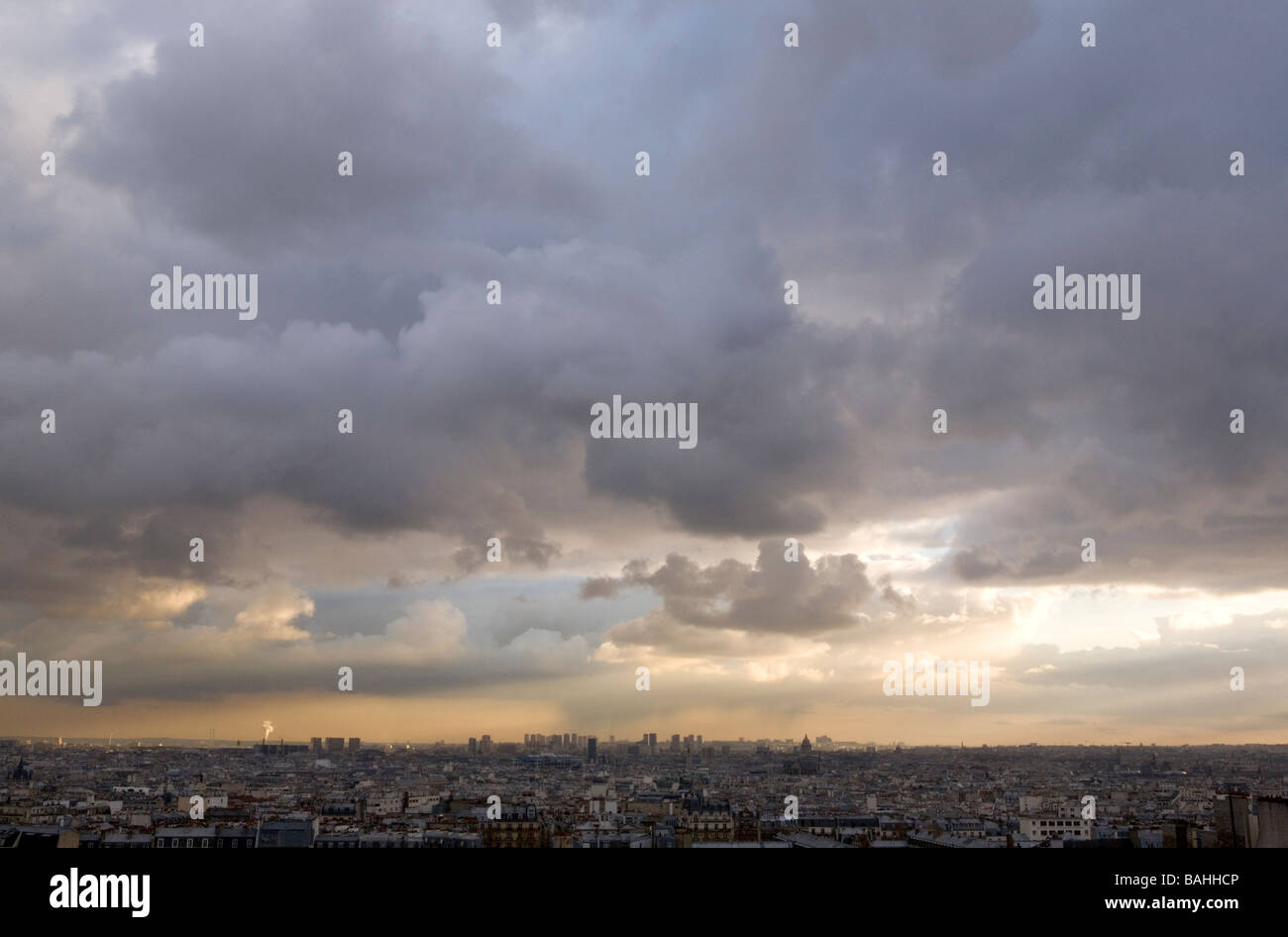 A view across Paris, France with a dramatic sky Stock Photo - Alamy