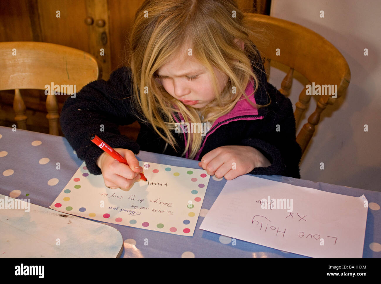 Young girl writing her thank you letters Stock Photo - Alamy