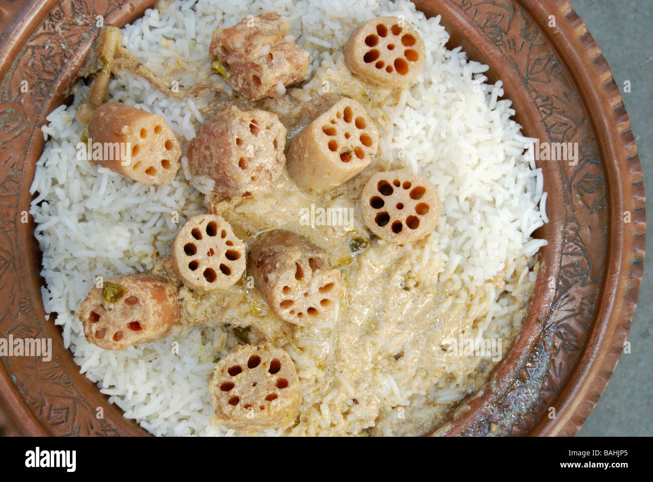 Lotus curry is an Indian dish made of lotus stem cooked in tomato onion ...