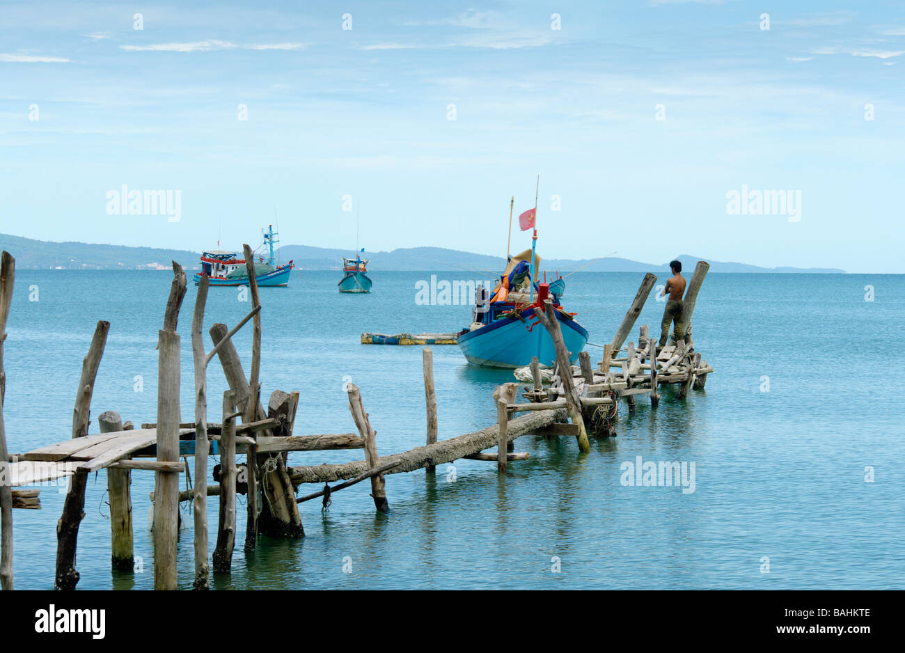 Fisherman meets a fishing boat. Island Phu Quoc, Vietnam Stock Photo ...