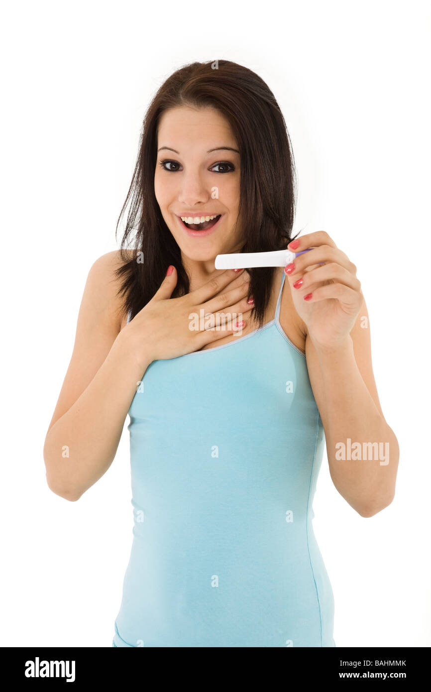 Young Caucasian woman looking at pregnancy test Stock Photo - Alamy