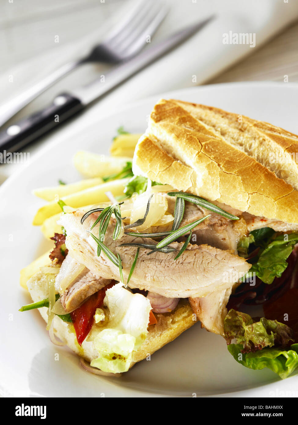 roast pork baguette on the plate ready to serve Stock Photo - Alamy