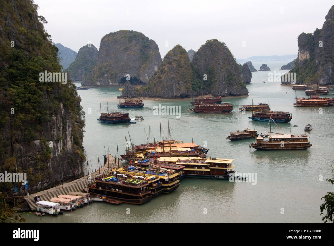 Scenic views of limestone karsts and tourist boats in Ha Long Bay ...