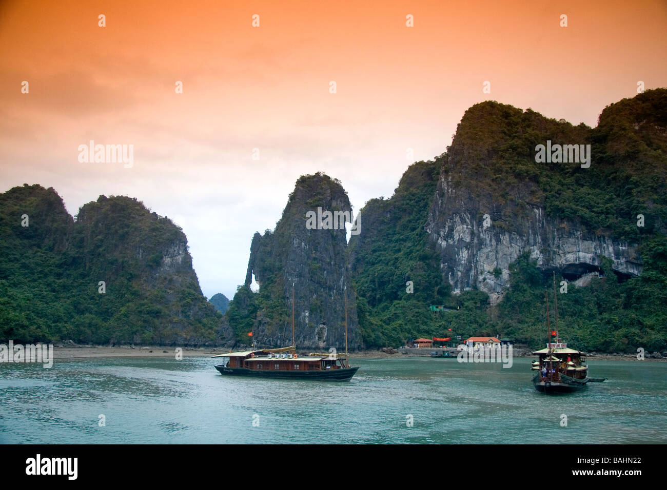 Scenic views of limestone karsts and tourist boats in Ha Long Bay ...