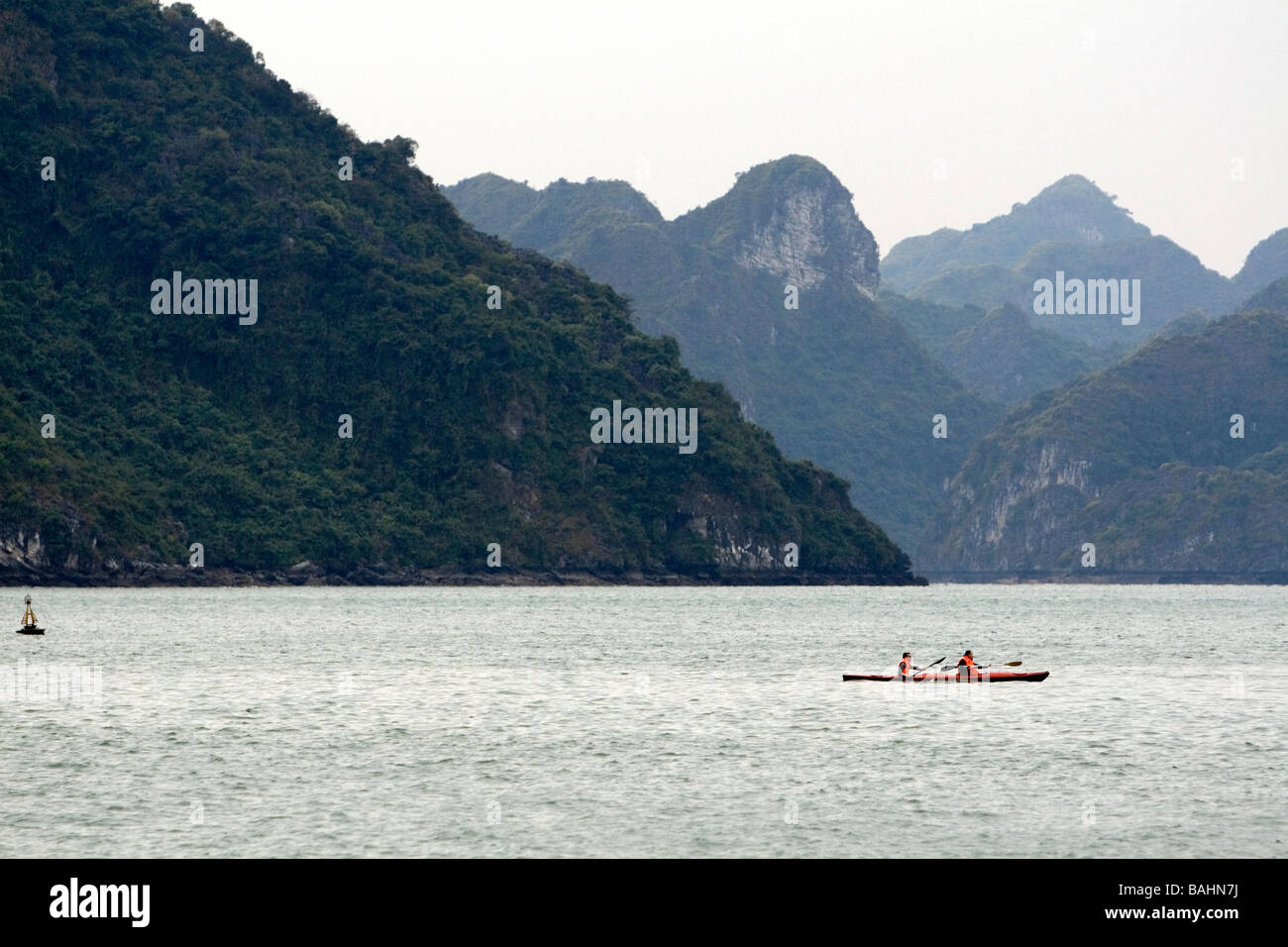 Sea kayaking in Ha Long Bay Vietnam Stock Photo - Alamy
