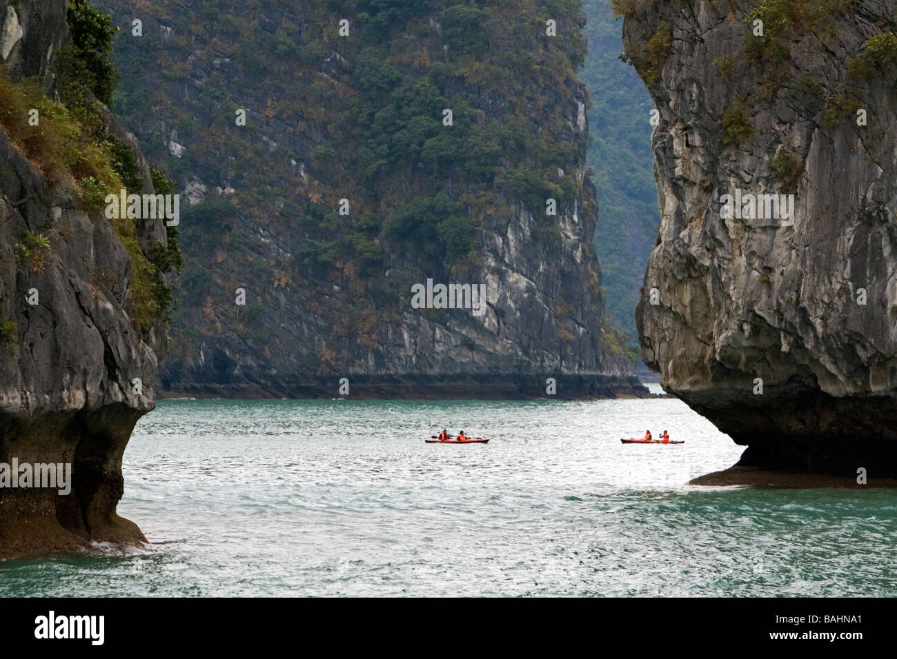 Sea kayaking in Ha Long Bay Vietnam Stock Photo - Alamy