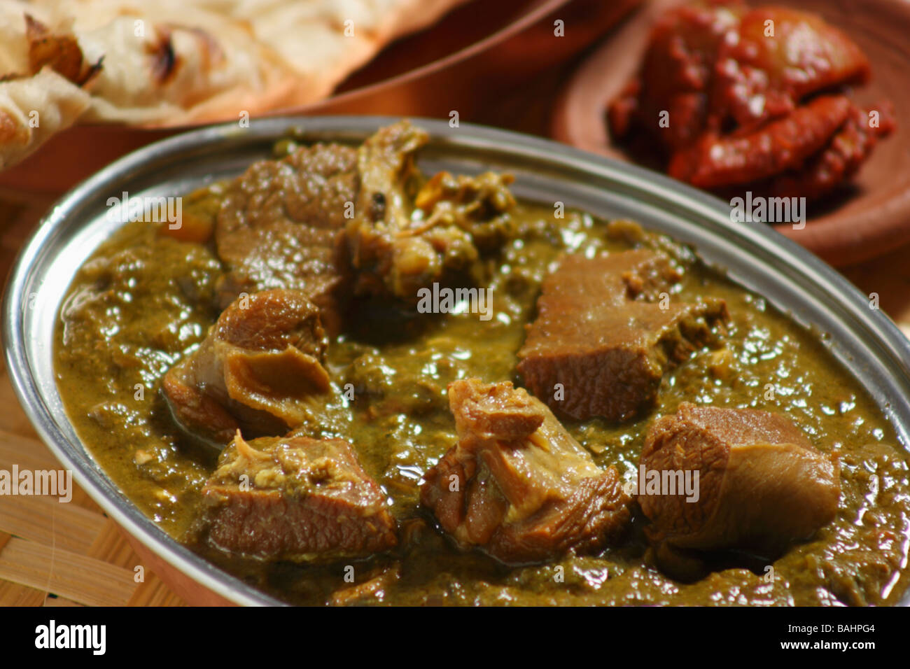 Saag mutton is prepared from mutton cooked in Palak gravy (Spinach) and ...