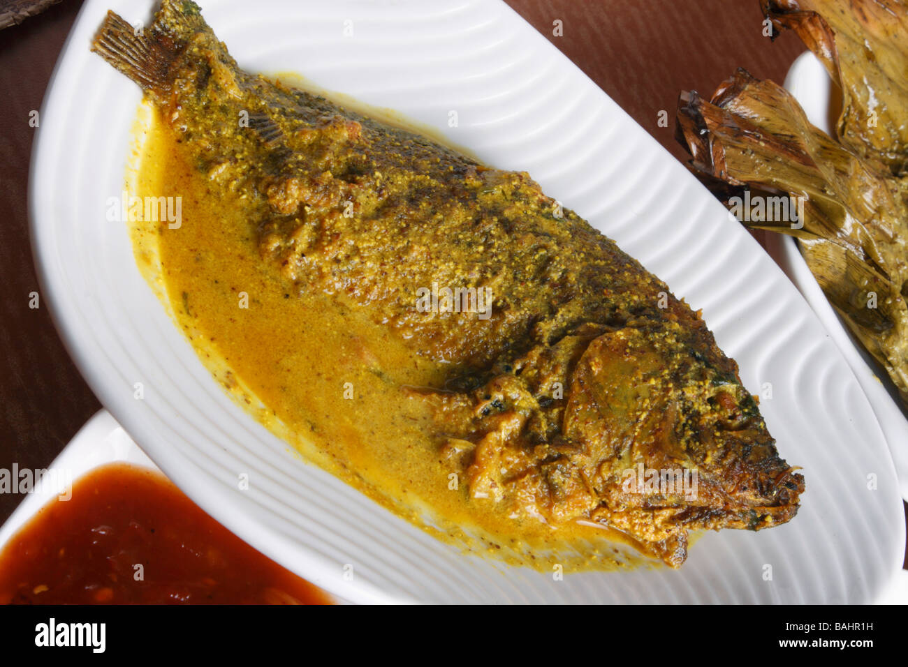 Maacher jhol is a traditional Bengali fish curry Stock Photo - Alamy