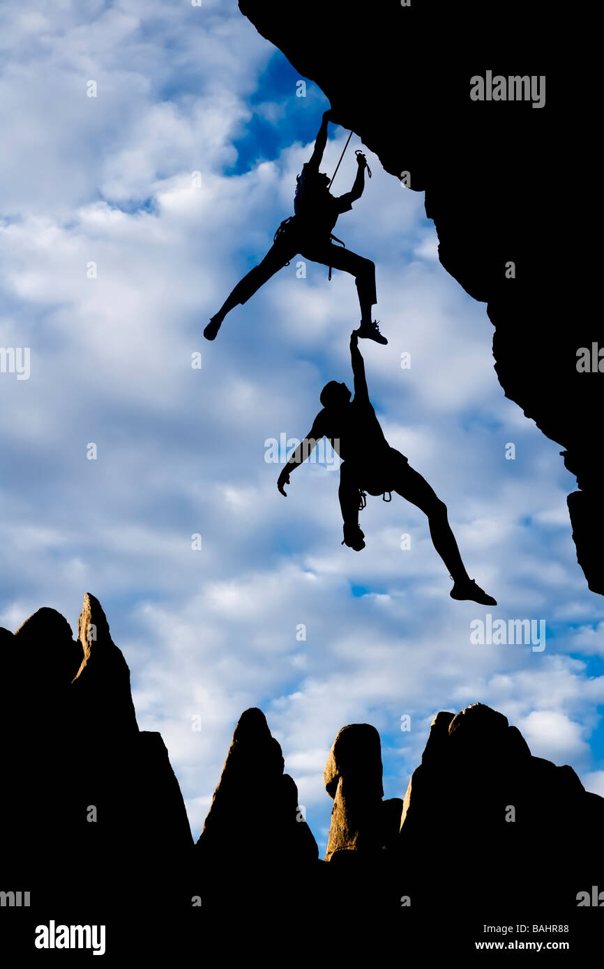 Team of climbers in trouble clinging to a cliff for dear life in The ...