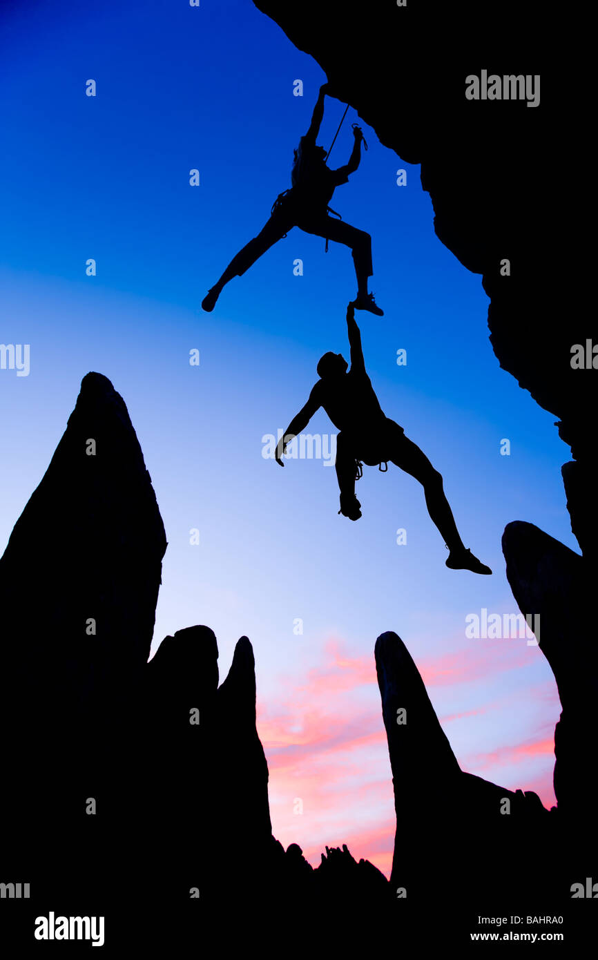 Team of climbers in trouble clinging to a cliff for dear life in The ...