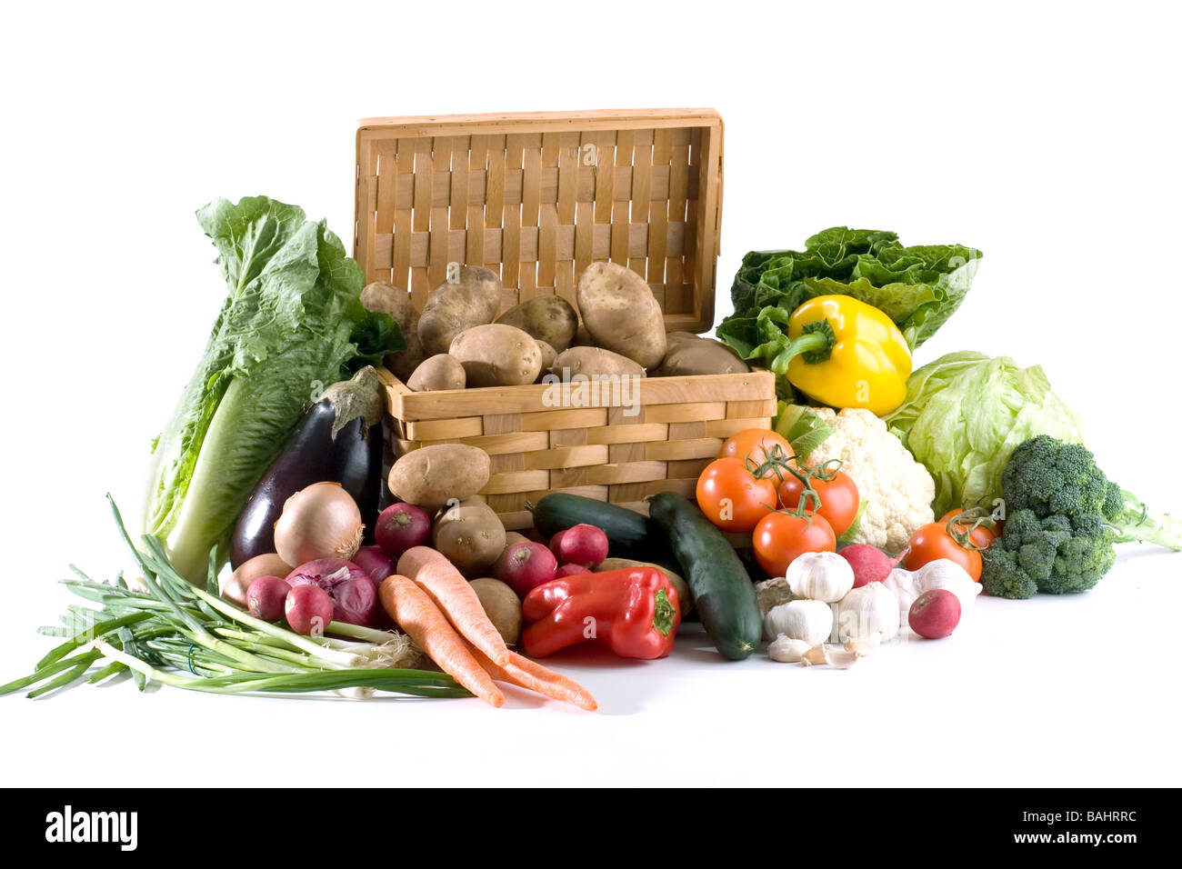 Heap of a lot of freshly picked vegetables around a wooden basket on ...