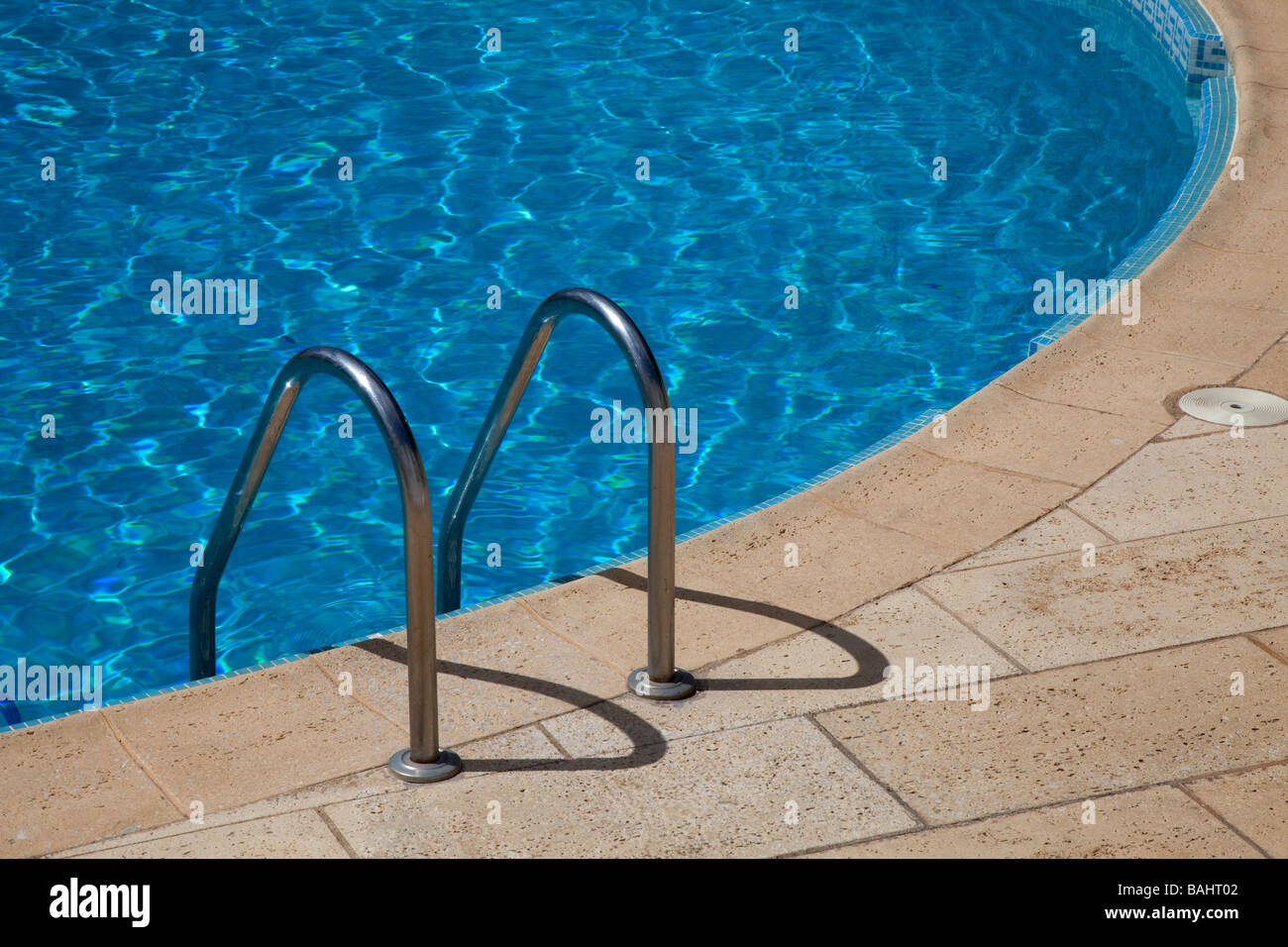 swimming pool blue water detail in summer time Stock Photo - Alamy