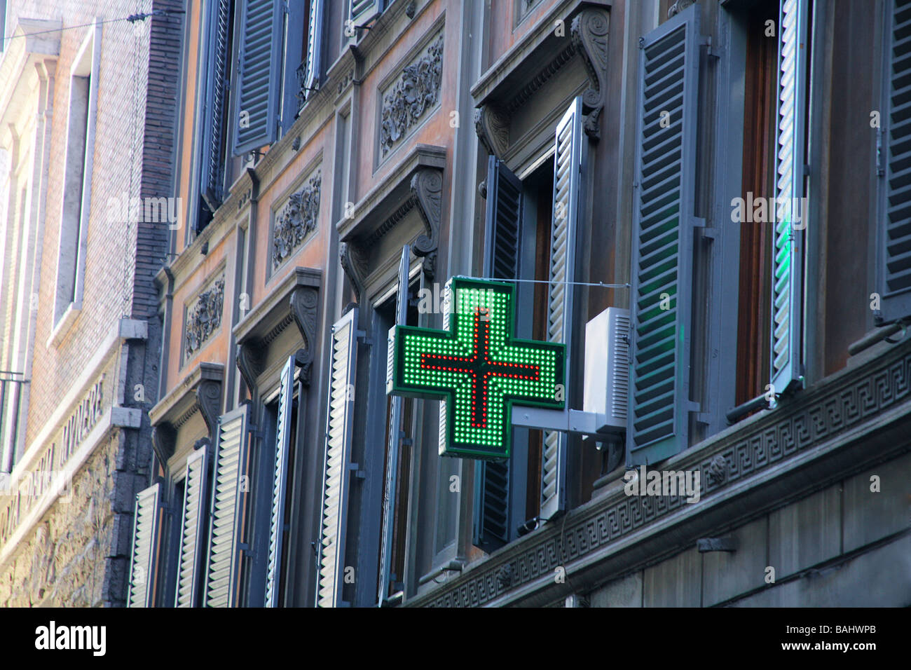 Rome, Italy; Red and Green Medical Cross on building Stock Photo - Alamy