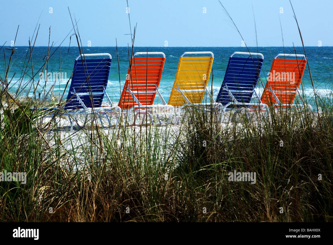 Bradenton Beach, Florida, USA; beach chairs lined on beach Stock Photo ...